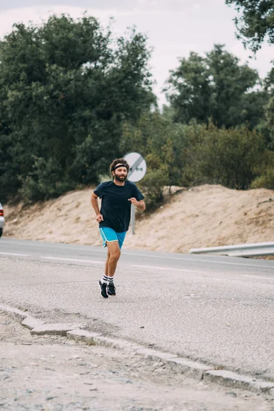 Classic vintage man does sport and runs in the field. - Stock Image ...