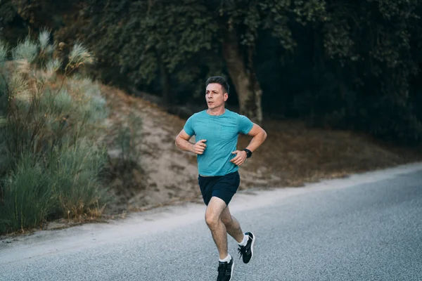 Classic vintage man does sport and runs in the field. - Stock Image ...