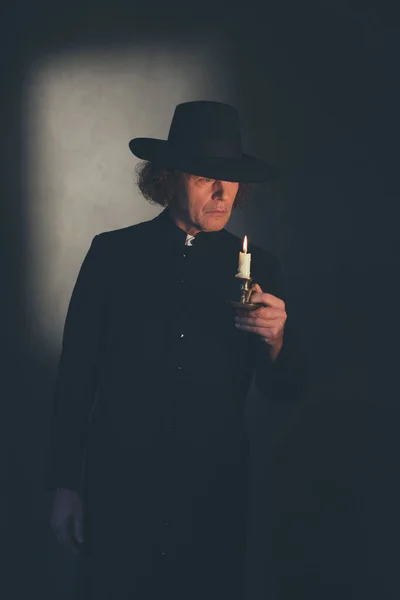 Edwardian man in long black coat and hat holding cane. Stock Photo by ...