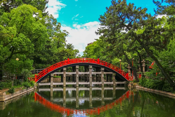 Red curve bridge and reflection in the river at Sumiyoshi Taisha Shrine ...