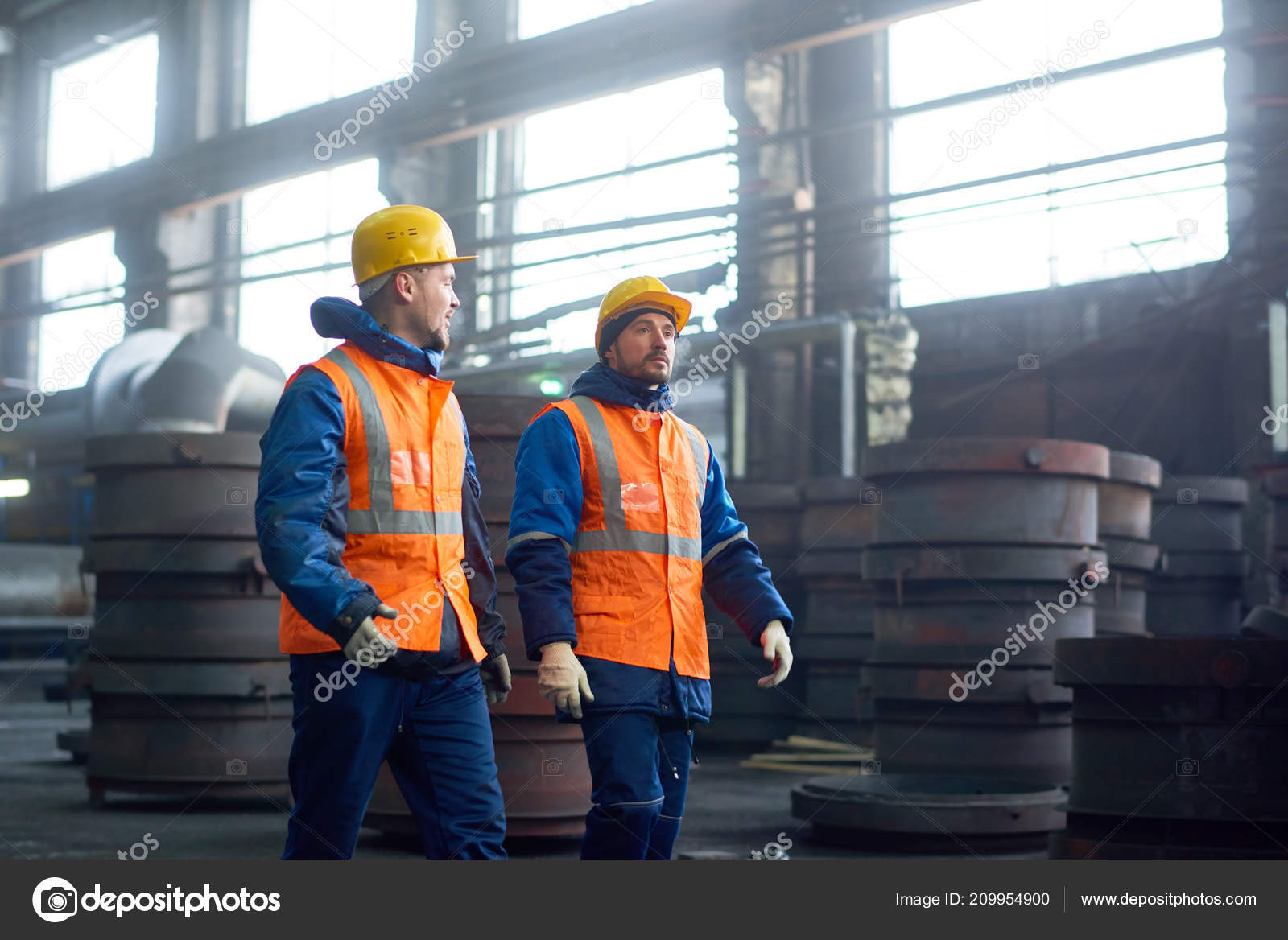 Brutal Young Machine Operators Wearing Protective Helmets Uniform ...