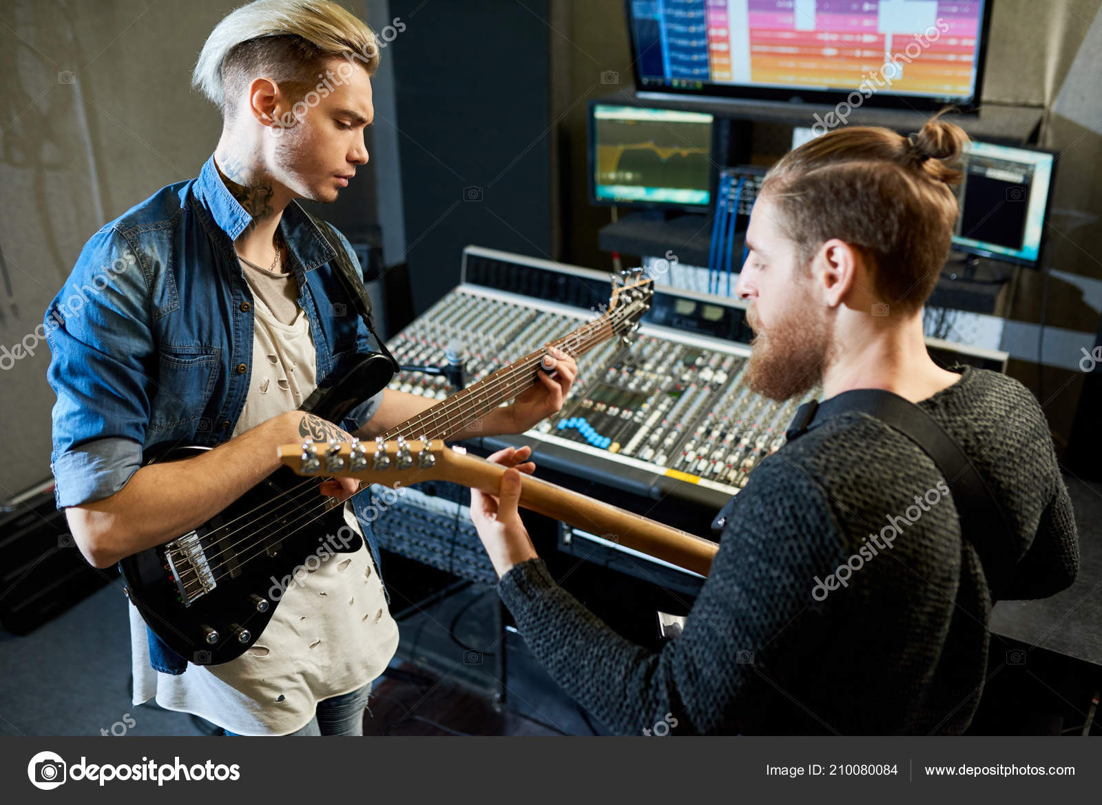 Two Men Guitars Playing Together While Making New Song Recording ...