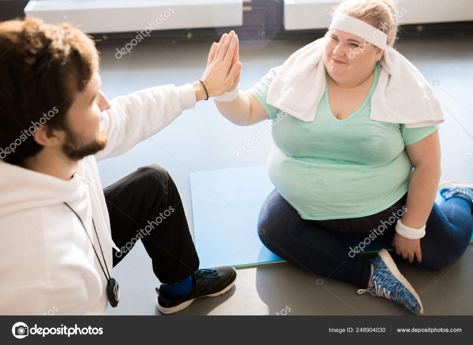 High Angle Portrait Smiling Obese Young Woman Sitting Floor Doing Stock ...