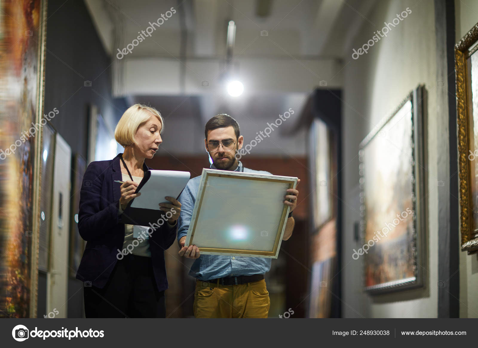 Portrait Two Museum Workers Inspecting Paintings Standing Art Gallery ...