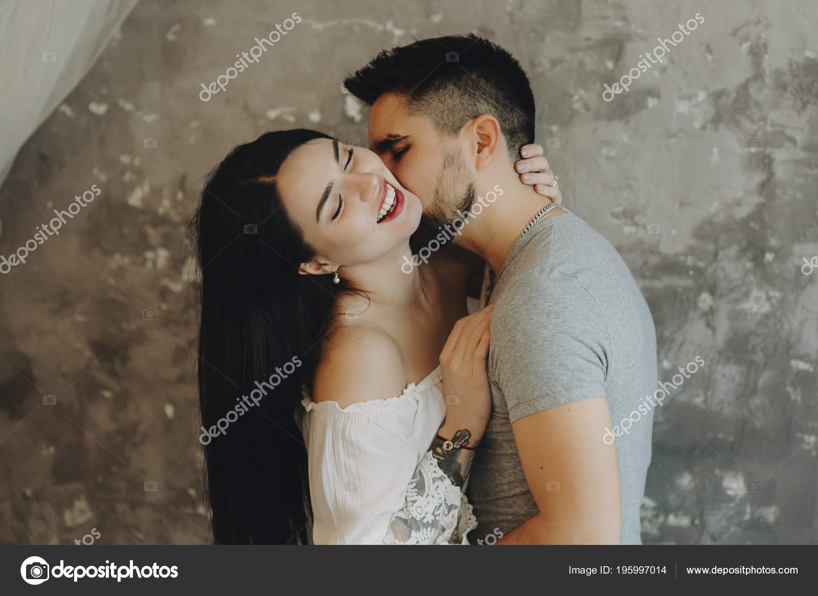 Man Kissing Girls Neck