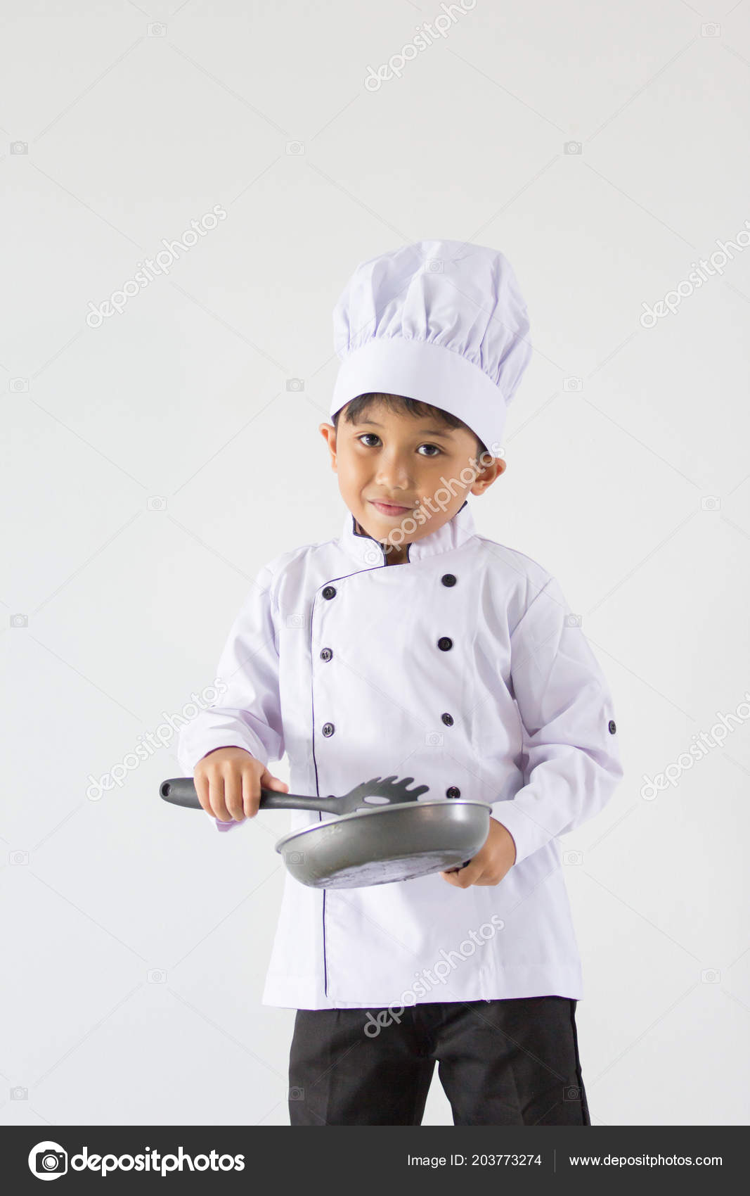 A boy in chef uniform on white background Stock Photo by ©odua 203773274