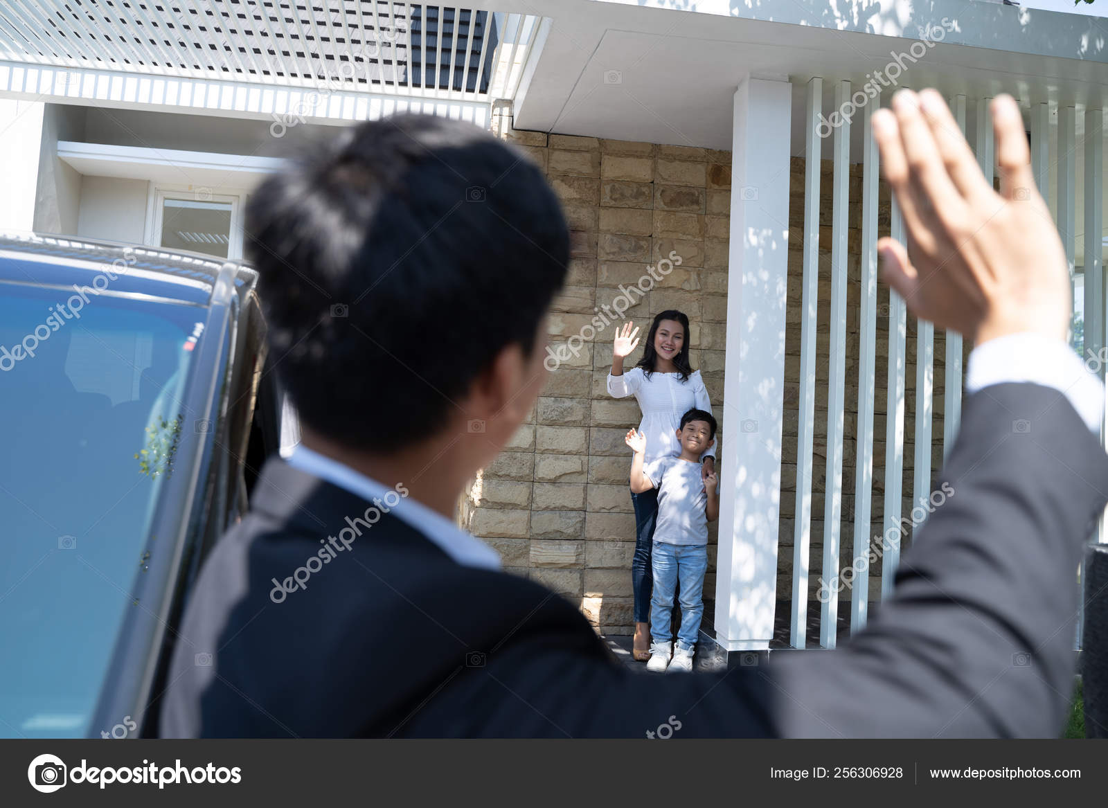 Family Waving Goodbye