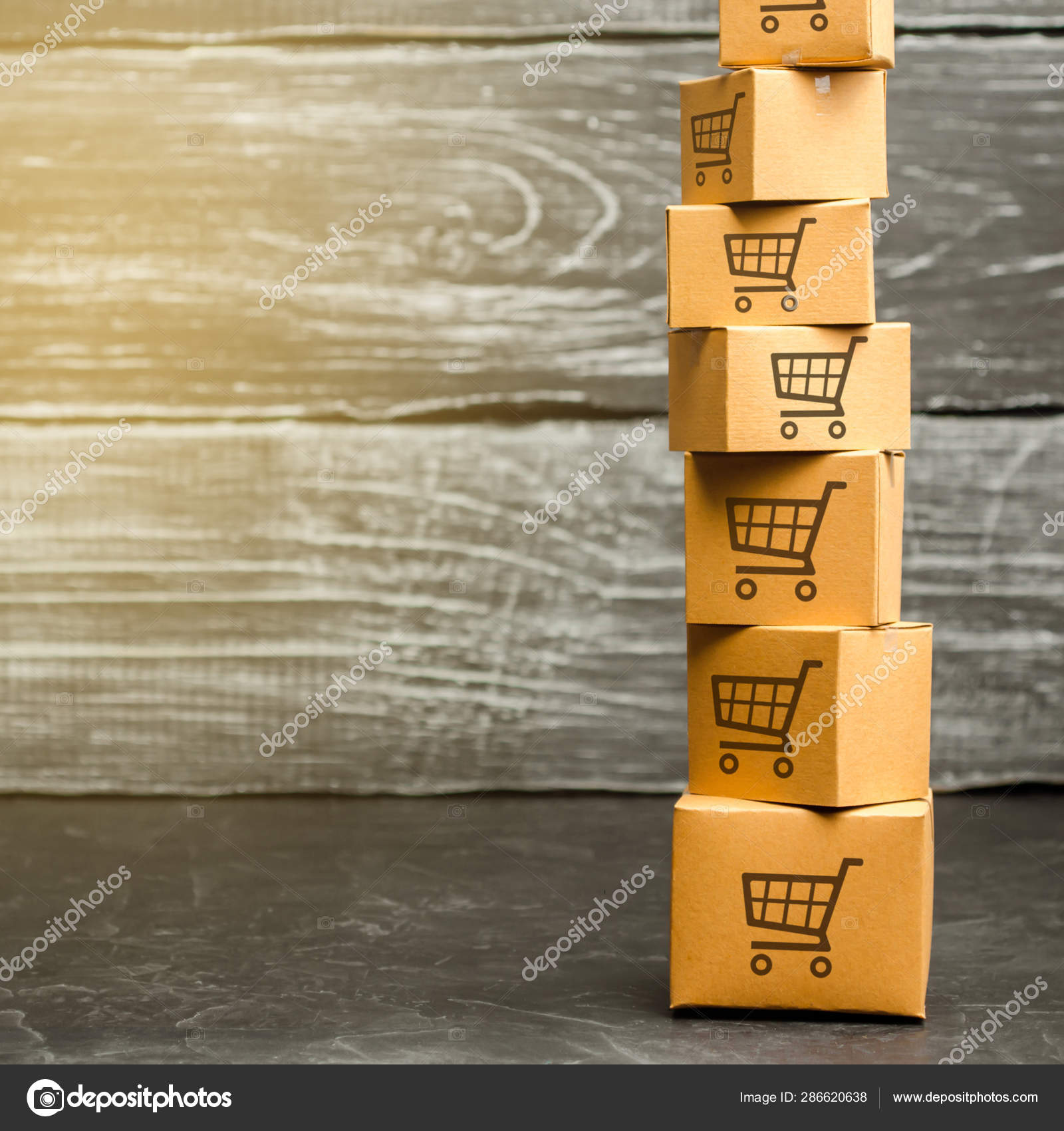 Tower of cardboard boxes with pattern of shopping carts. Purchasing ...