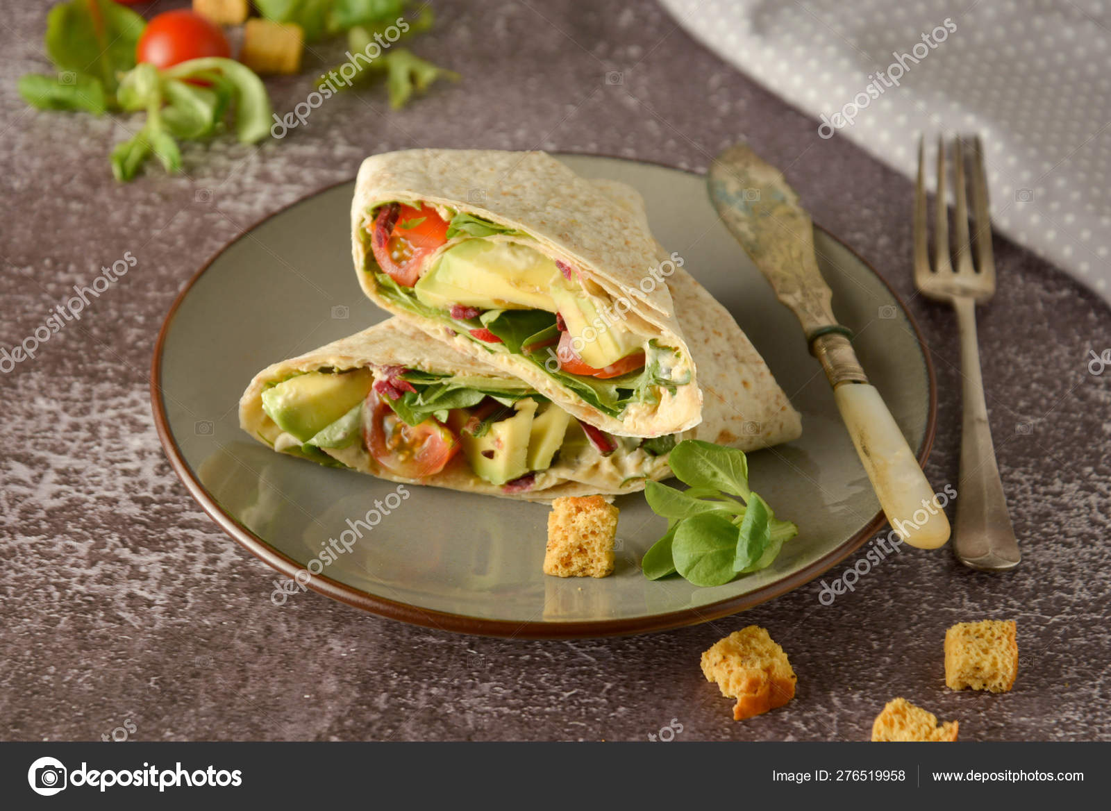 Tortilla wraps with avocado, cherry tomato. Healthy, vegan food. Take ...