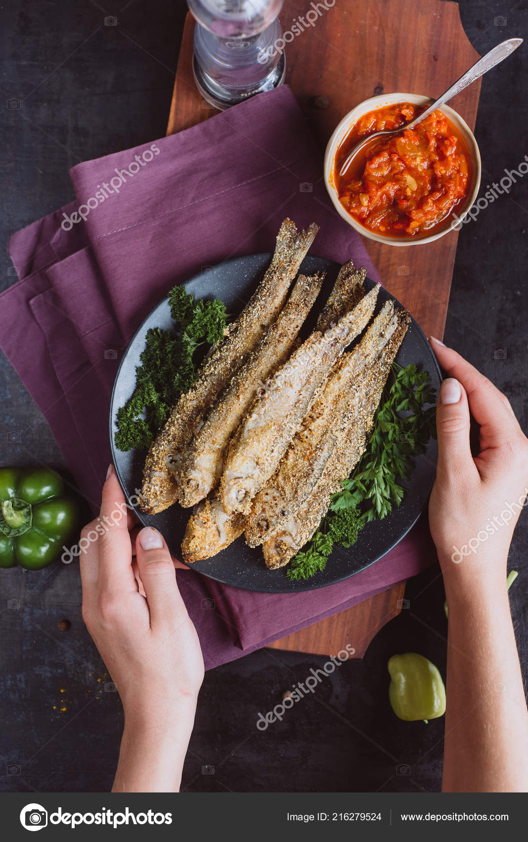 Hands Hold Fried Fish Plate Tomato Sauce Greens Peppers Wooden — Stock ...
