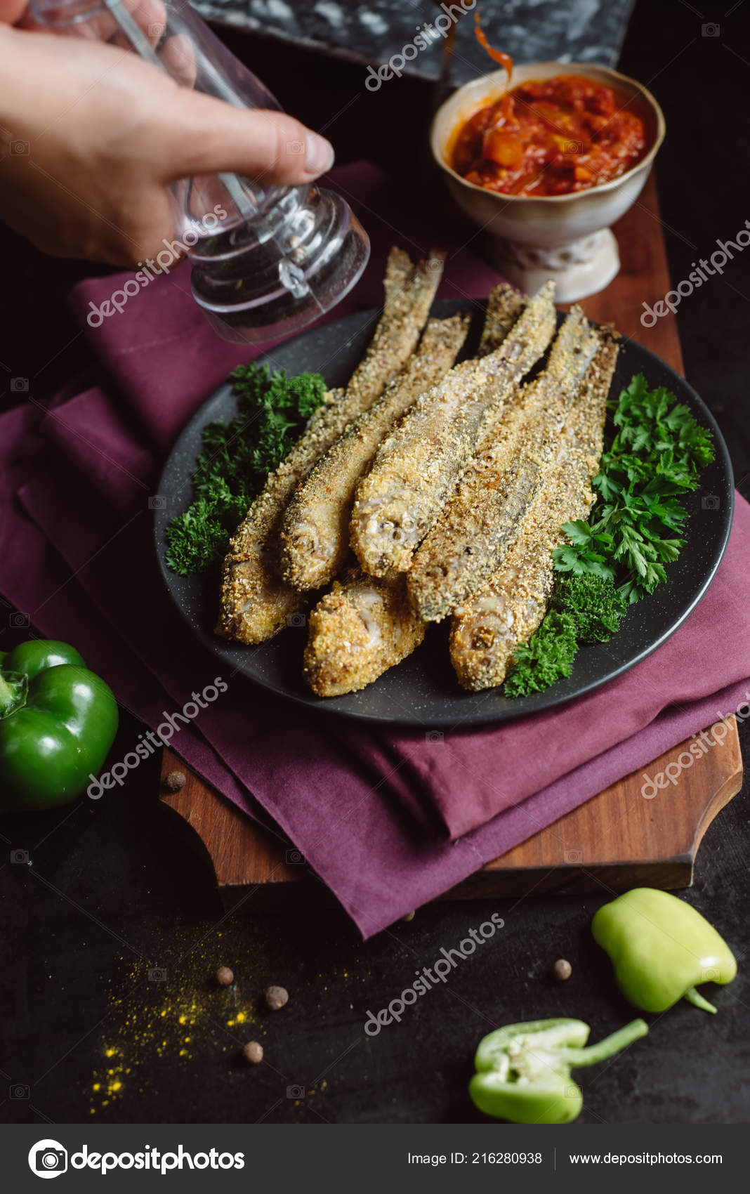 Chef's Hands Sprinkle Seasoning Fried Fish Plate Tomato Sauce Greens ...