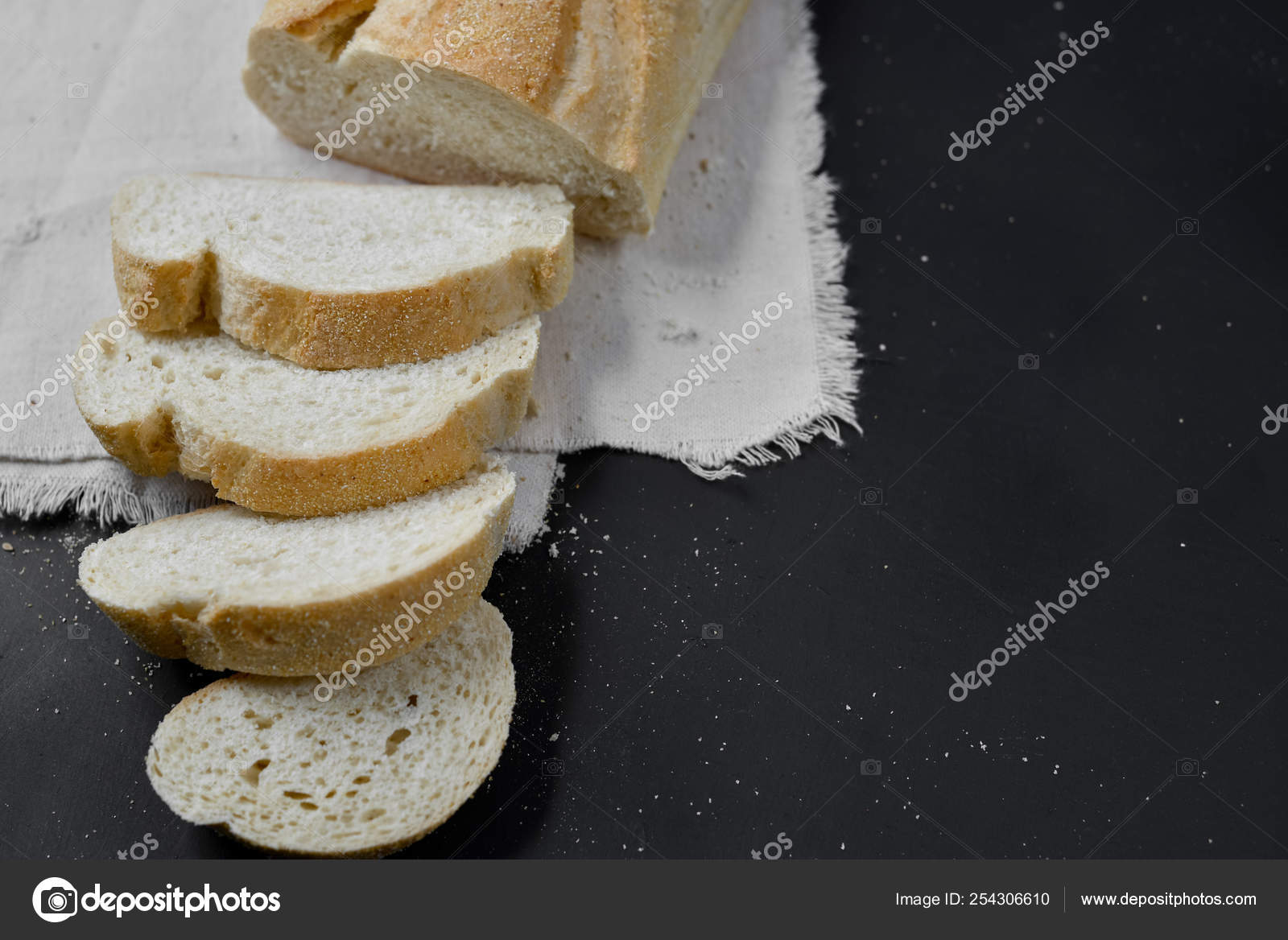 Bakery - fresh homemade sliced bread on black chalkboard background ...