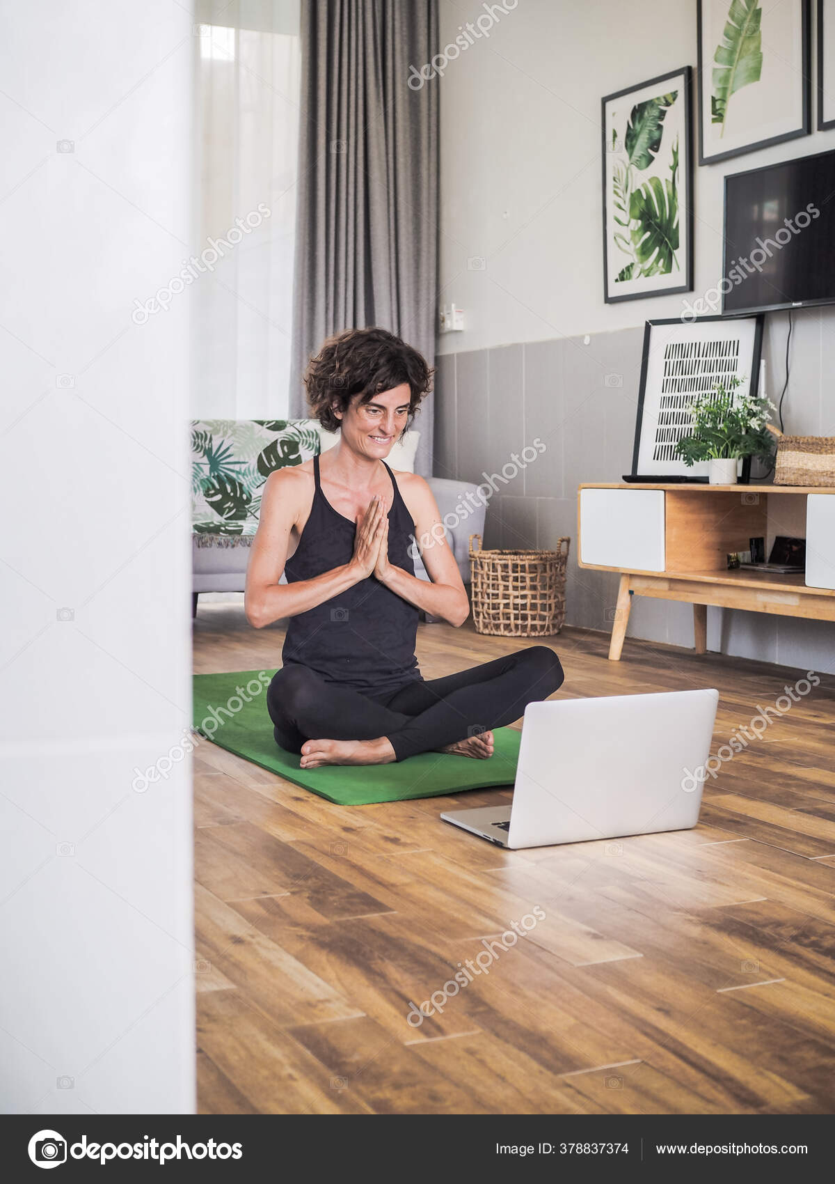 Woman Practicing Yoga Home Sitting Front Laptop — Stock Photo © shellygraphy #378837374