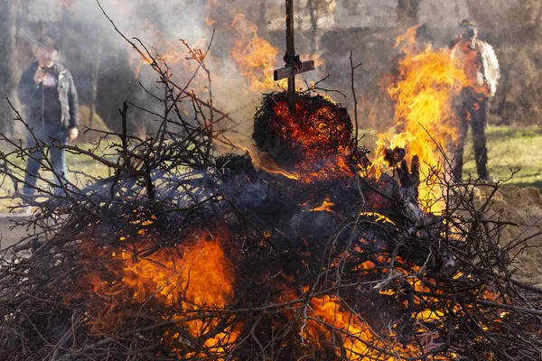 Flaming fire. Burning tree branches. Pagan rite dedicated to the ...