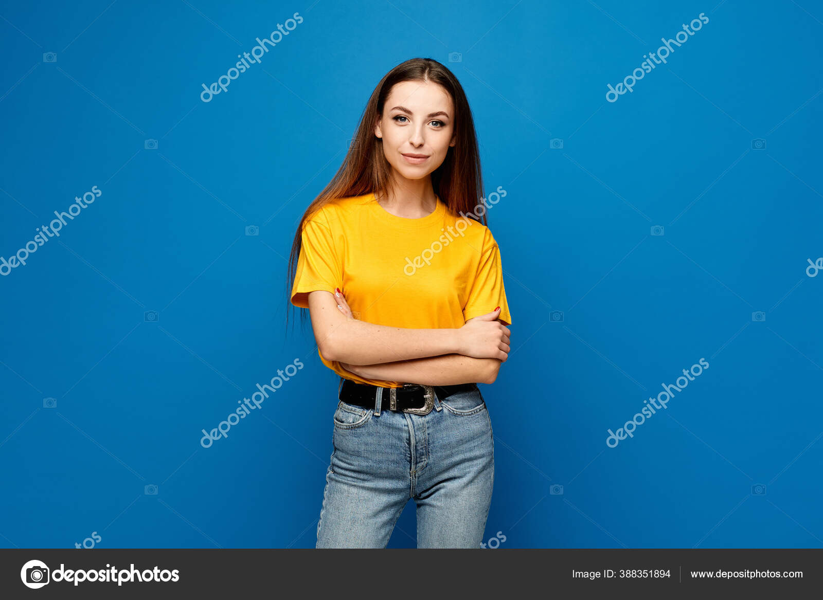 Front view of a model girl with slim body in oversized yellow t-shirt ...