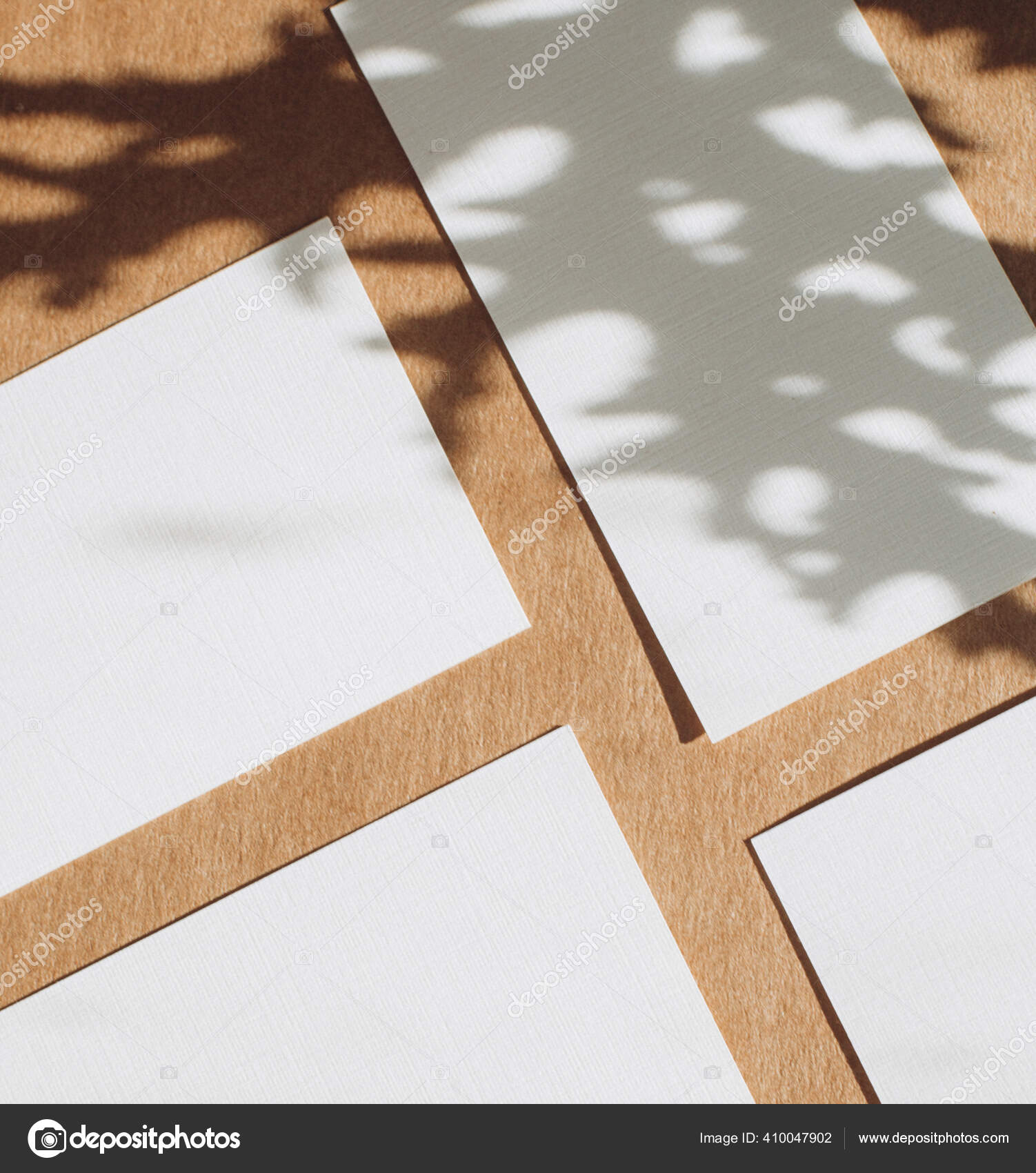 Four White Blank Sheets Table Shadow Free Space Inscription Stock Photo ...