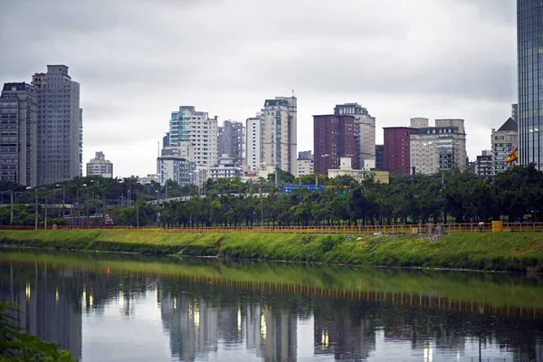 Buildings of Marginal Pinheiros reflected in the waters of the ...
