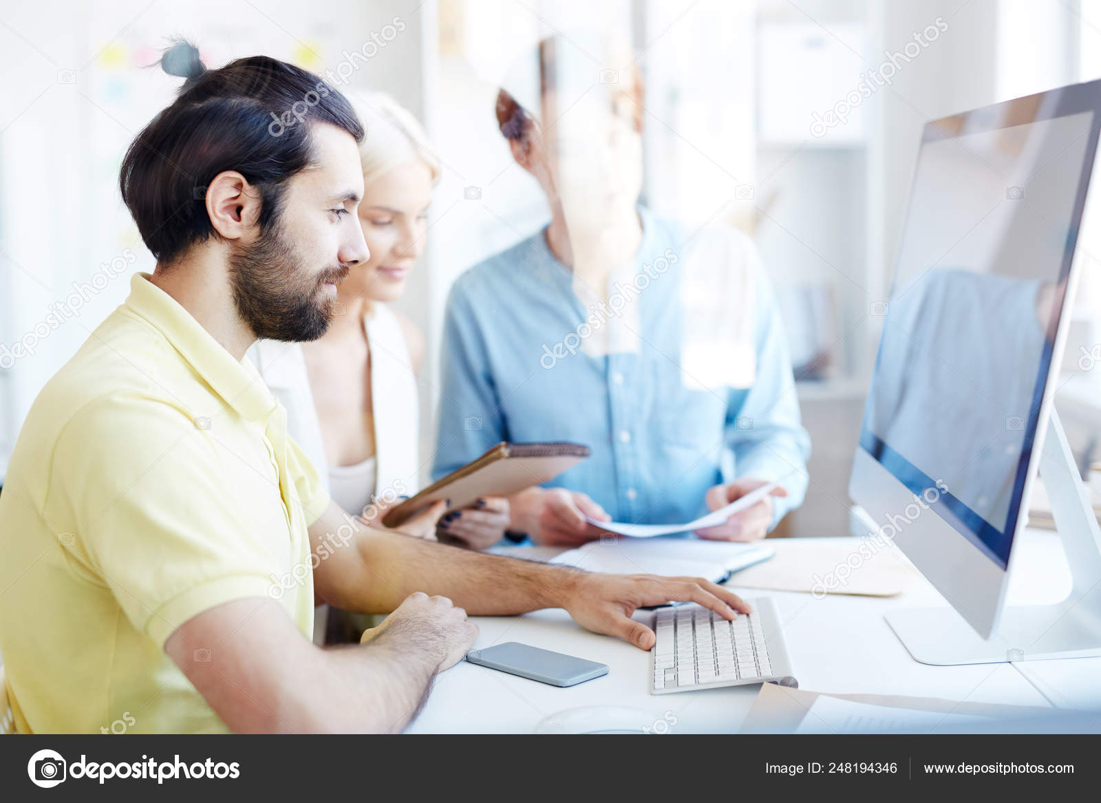 Young Creative Man His Colleagues Sitting Front Computer Monitor ...