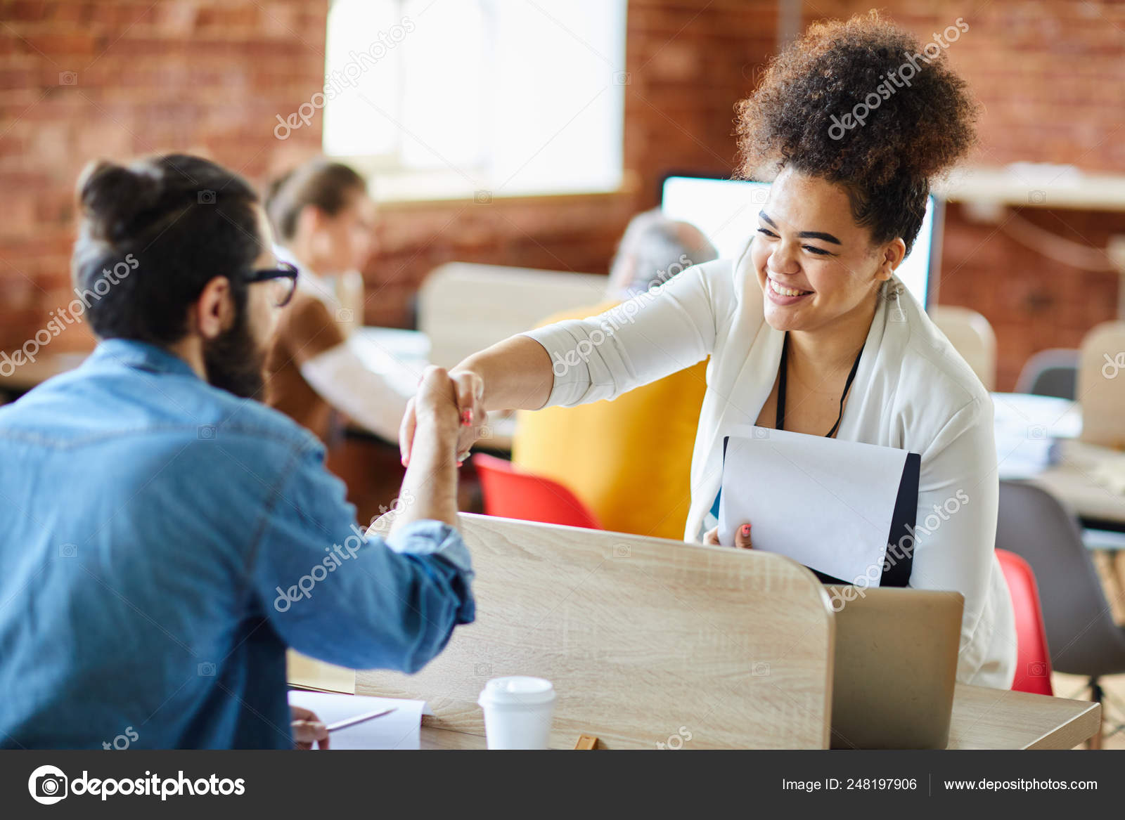 Two Young Intercultural Colleagues Shaking Hands Border Desks Office ...