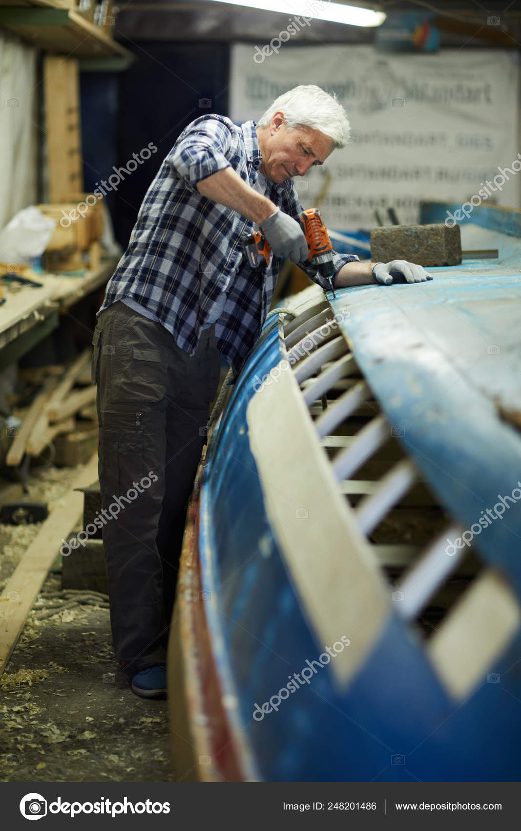 Aged Grey Haired Shipbuilding Master Drilling One Vessel Bottom Board ...
