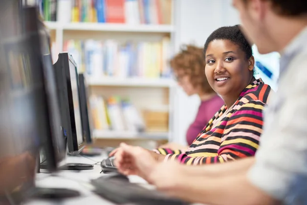 Smiling African female student attending training course in a computer ...