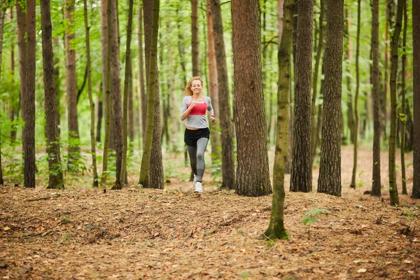 Woman running in summer park — Stock Photo © blasbike #45397509