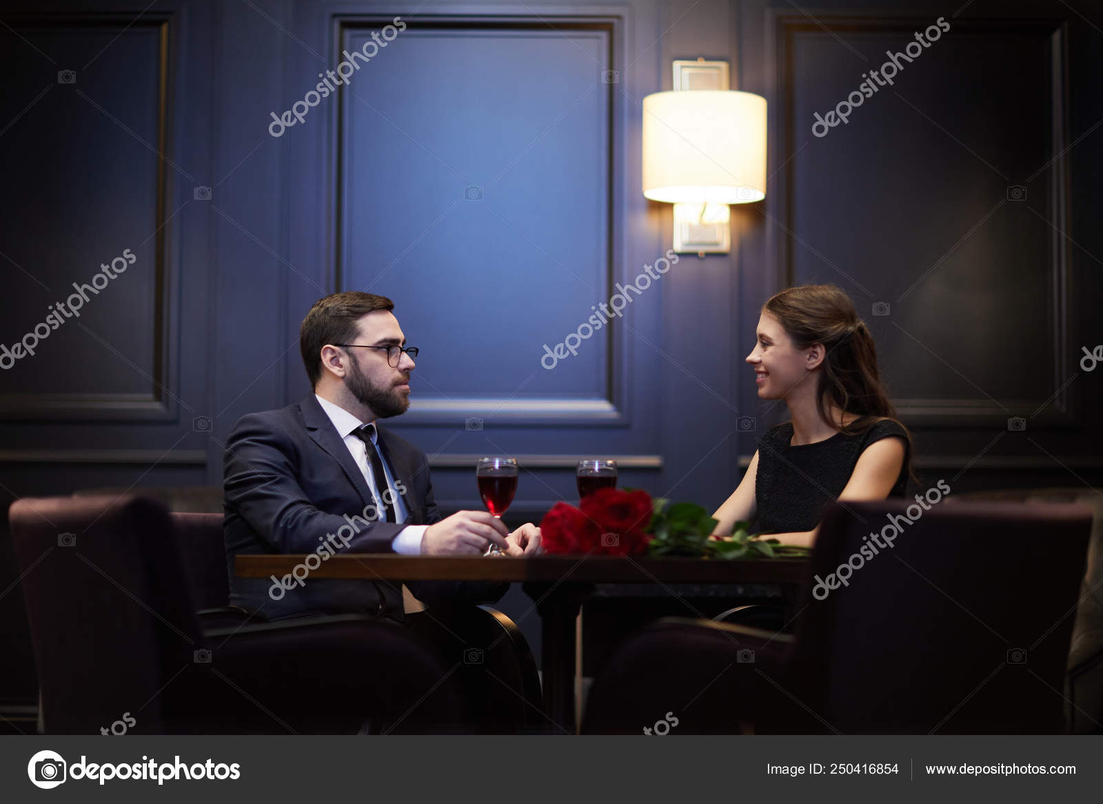 Young Romantic Dates Sitting Table One Another While Enjoying Talk ...