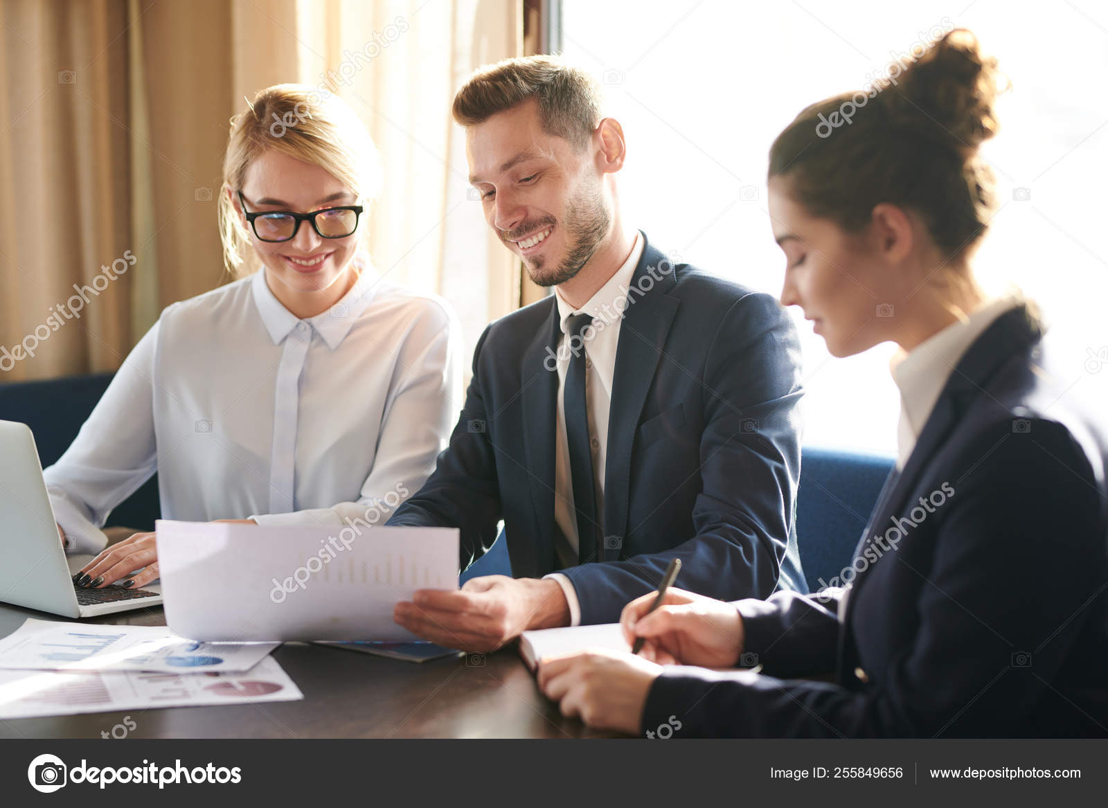 Young Confident Trader Showing His Colleague Financial Paper Explaining ...