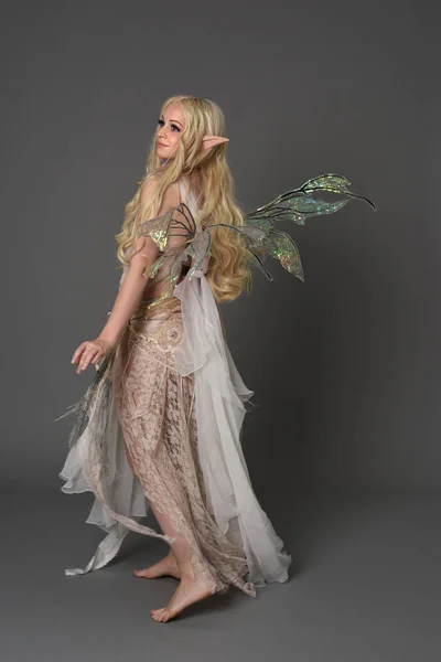 Full Length Portrait Blonde Girl Wearing Fantasy Fairy Costume Seated ...