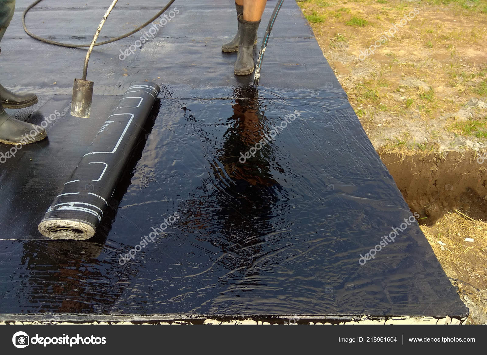 Professional installation of waterproofing on the concrete foundation ...