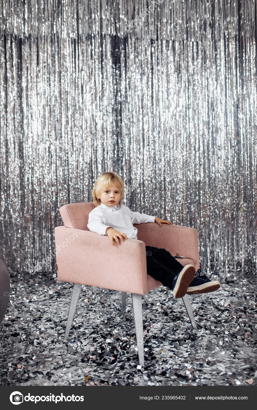 Happy Cute Boy Sitting Chair Studio Stock Photo by ©SHUNEVICH 235965402