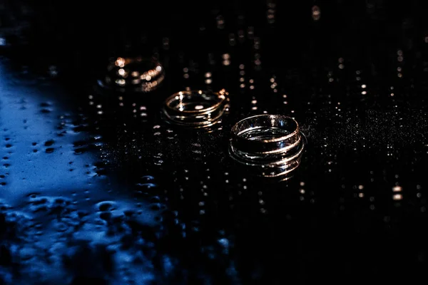 Beautiful Wedding Rings Wet Background Close Stock Photo by ©SHUNEVICH ...