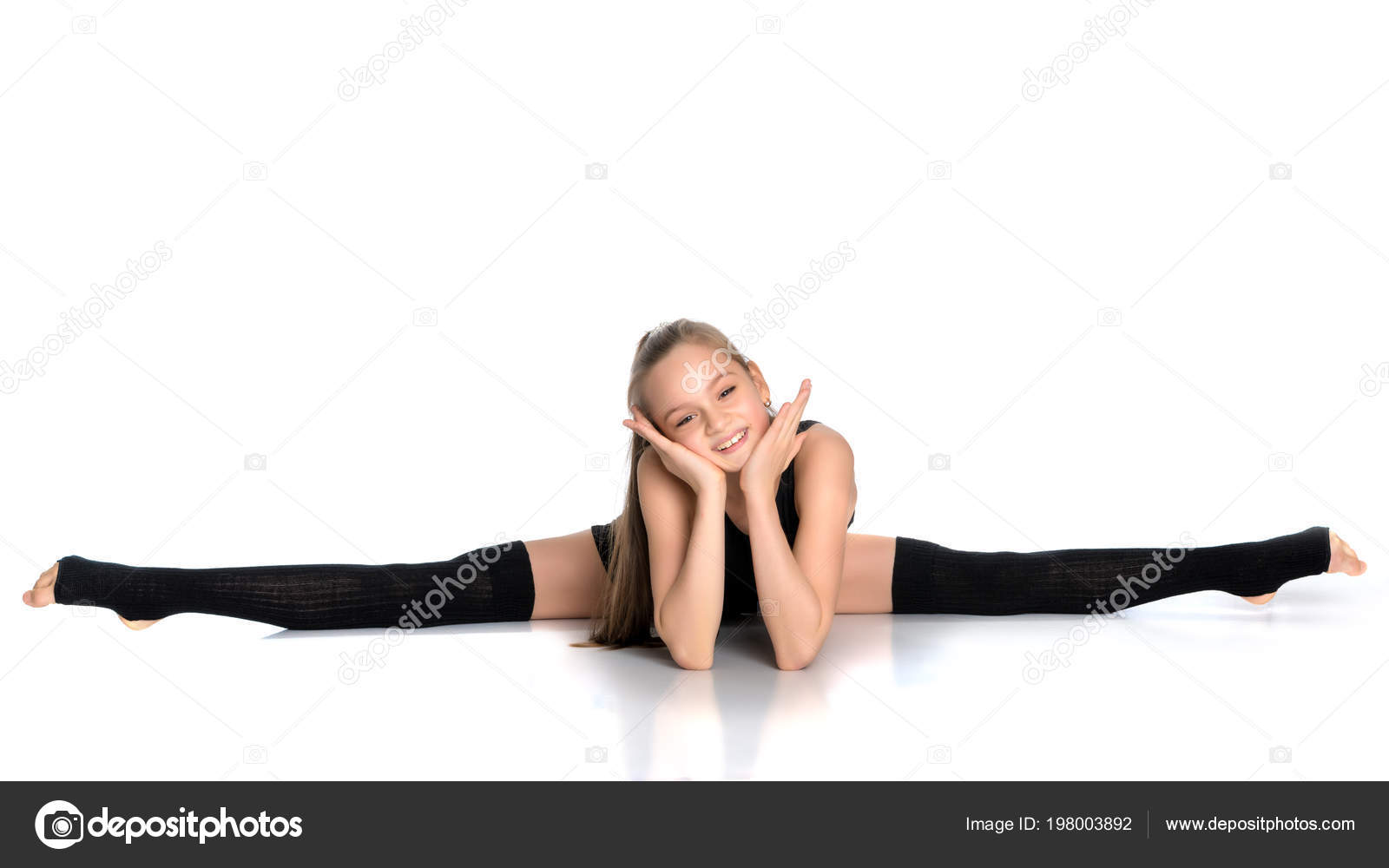 Girl gymnast perform the twine exercise. — Stock Photo © lotosfoto1 #198003892