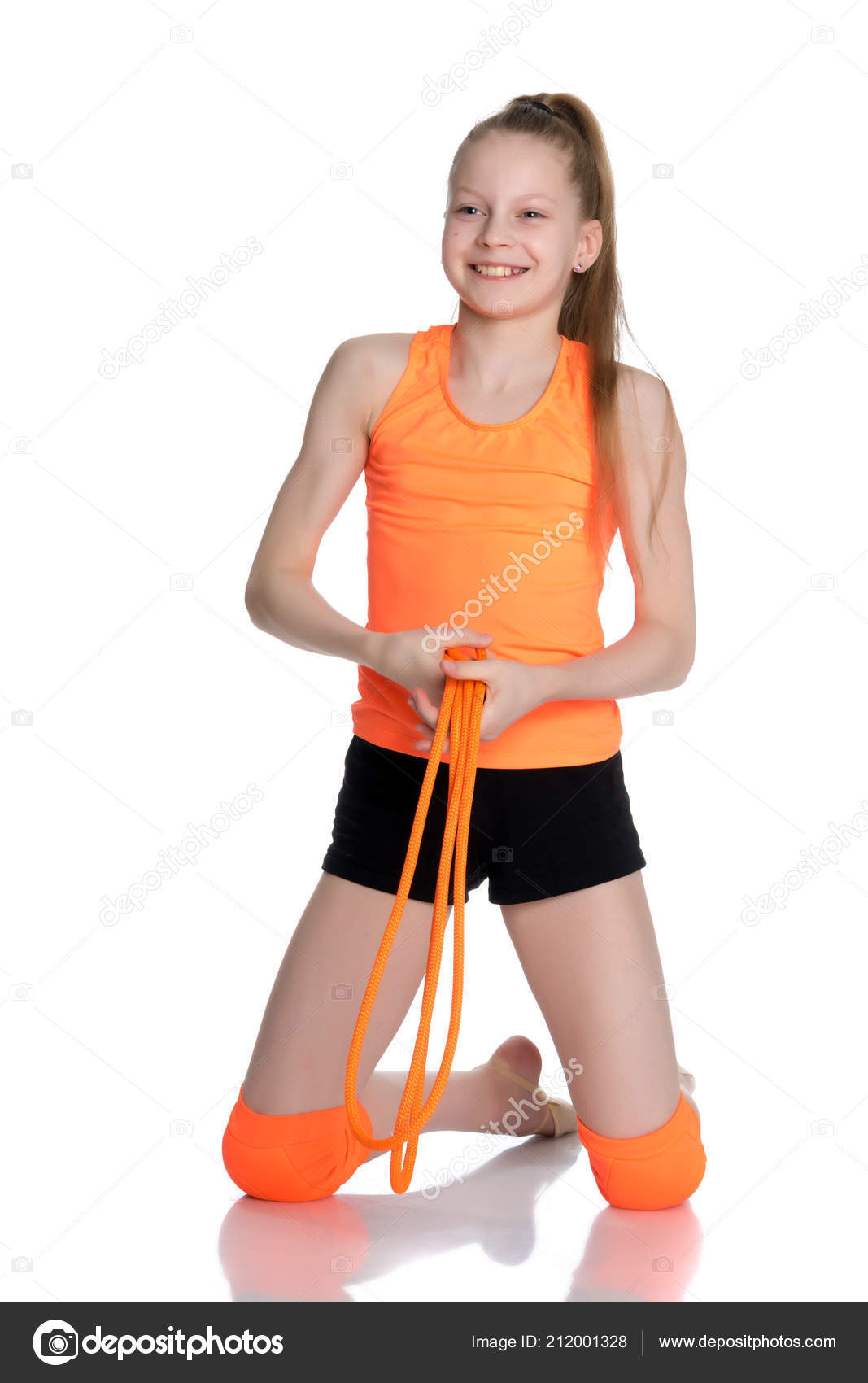 A girl gymnast performs exercises with a skipping rope. Stock Photo by ...