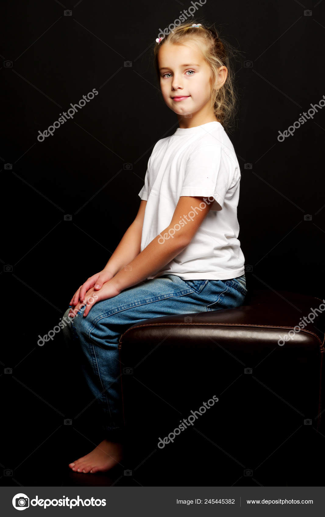 Little girl on a black background — Stock Photo © lotosfoto1 #245445382 Little girl on a black background — Stock Photo © lotosfoto1 #245445382