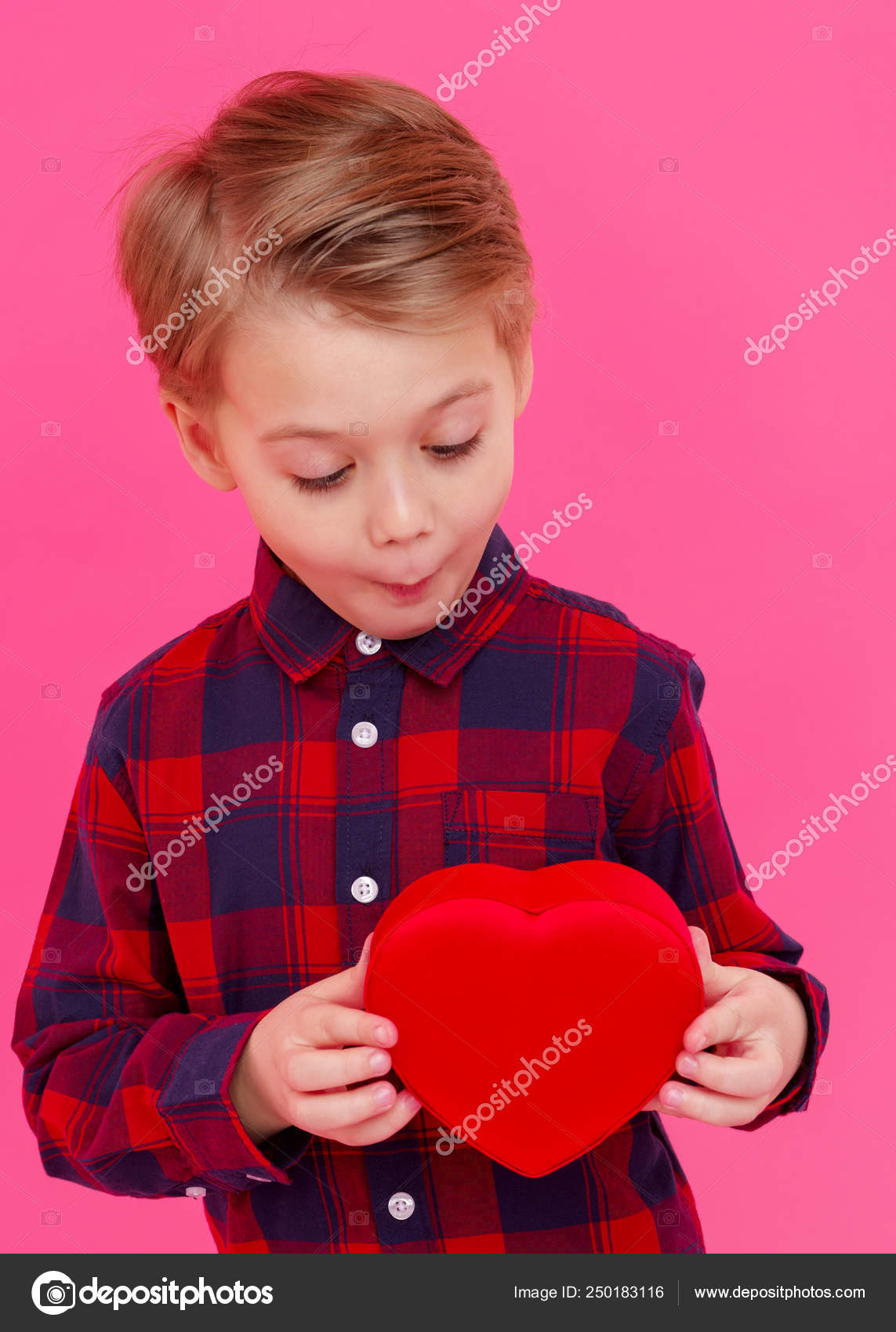 Little boy with a heart. Stock Photo by ©lotosfoto1 250183116