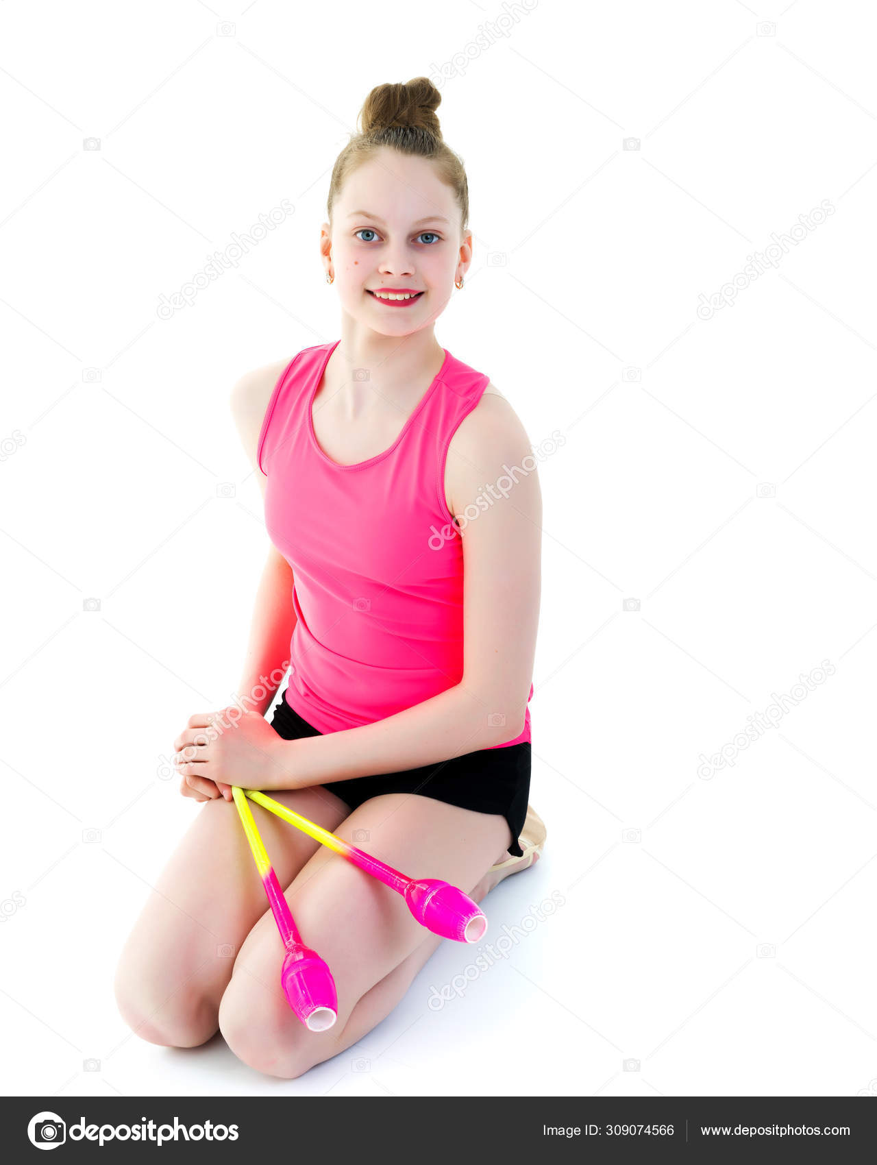A girl gymnast performs exercises with a mace. Stock Photo by ...