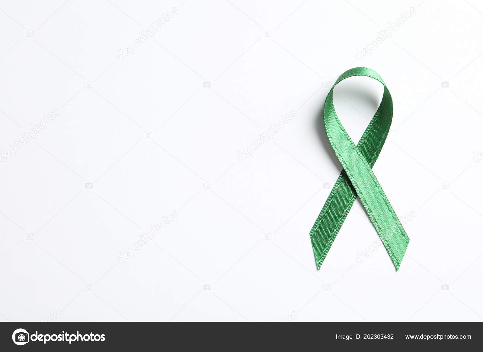 Green Ribbon White Background Top View Cancer Awareness Stock Photo by ...