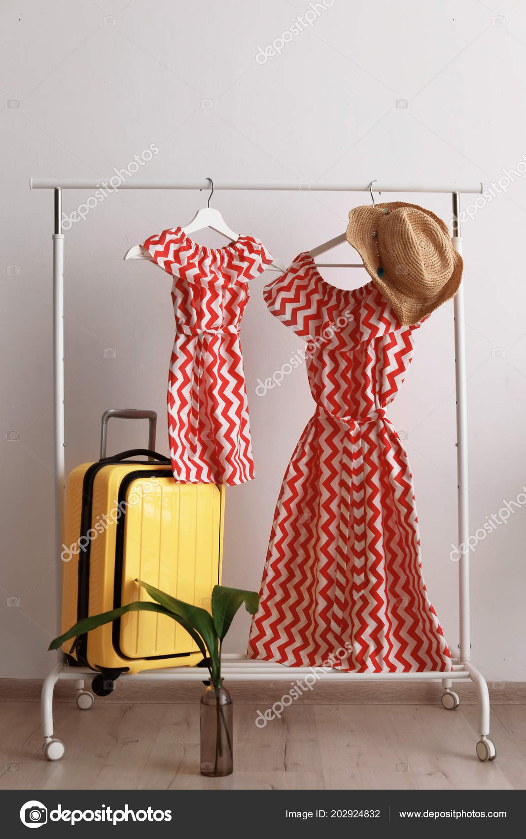 Packed Yellow Suitcase Rack Clothes Indoors — Stock Photo © NewAfrica ...