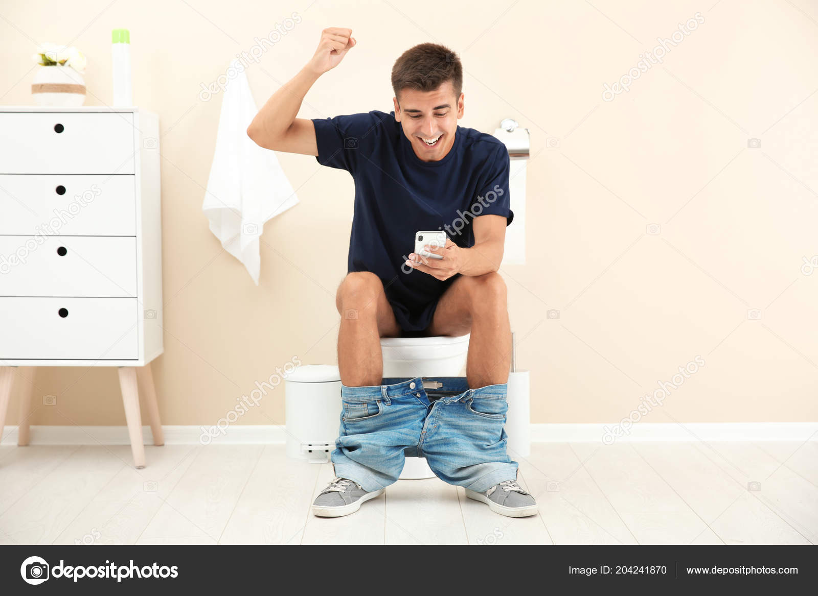 Man Using Toilet