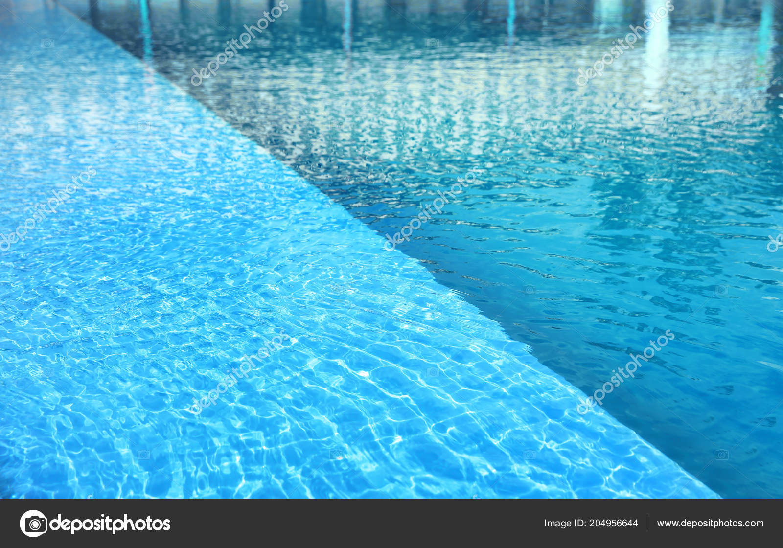 Clear Refreshing Water Swimming Pool Stock Photo by ©NewAfrica 204956644