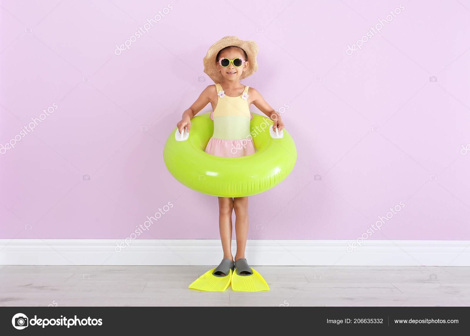 Cute Little Girl Inflatable Ring Wearing Flippers Color Wall Stock ...