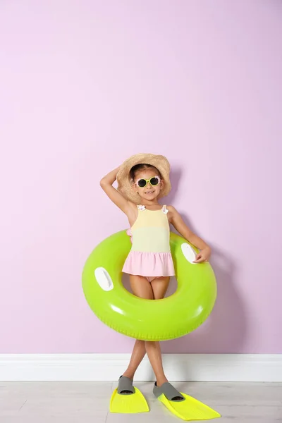 Cute Little Girl Inflatable Ring Color Wall Stock Photo by ©NewAfrica ...