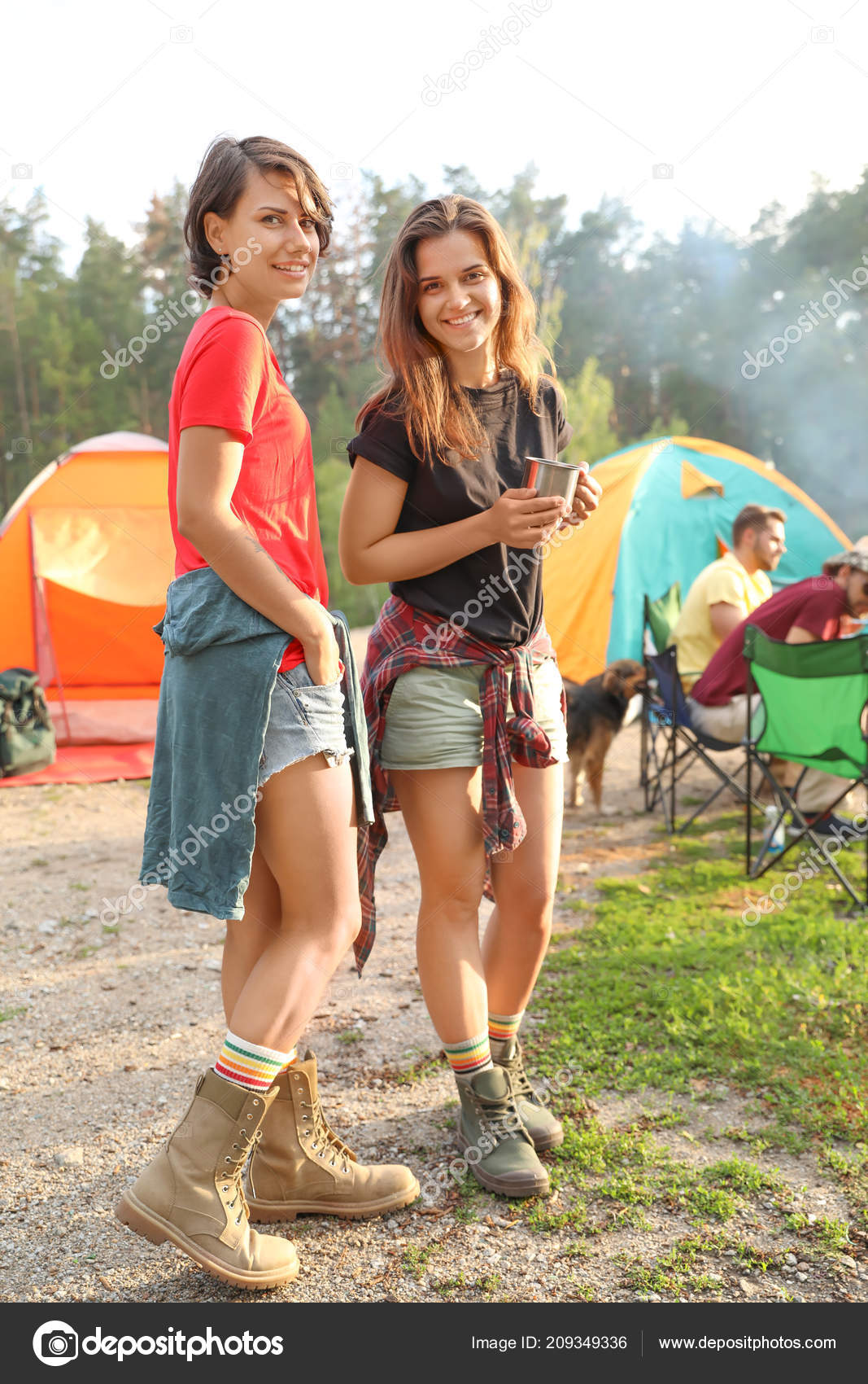 Young Women Camping Tents Wilderness Stock Photo by ©NewAfrica 209349336