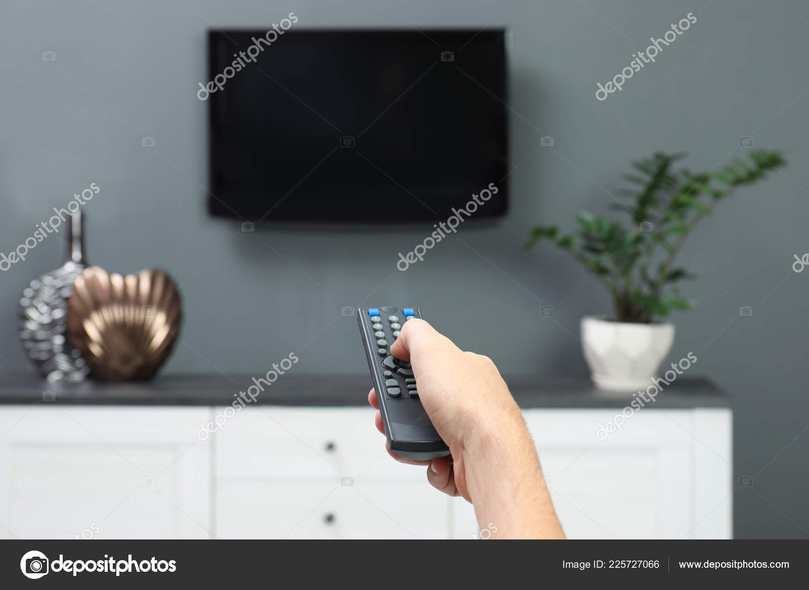 Man Switching Channels Plasma Remote Control Home — Stock Photo © NewAfrica #225727066