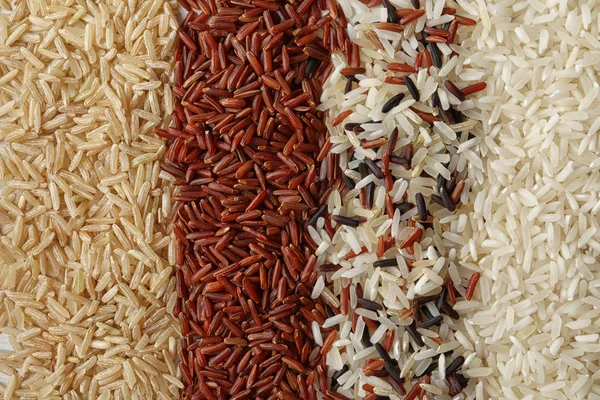 Different Types Brown Rice Background Top View Stock Photo by ...
