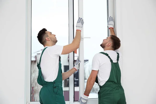 Construction Worker Adjusting Installed Window Screwdriver Indoors ...