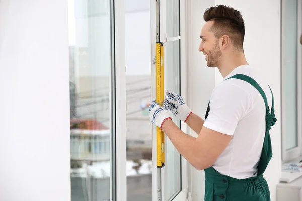 Construction Worker Adjusting Installed Window Screwdriver Indoors ...
