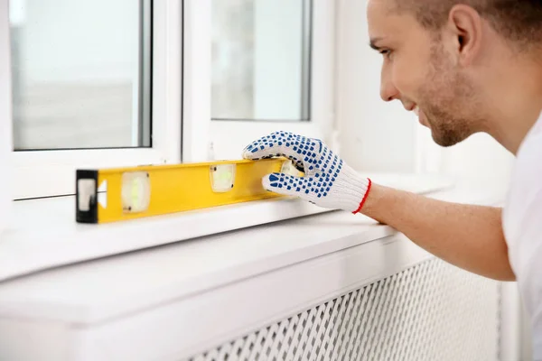 Construction Worker Adjusting Installed Window Screwdriver Indoors ...