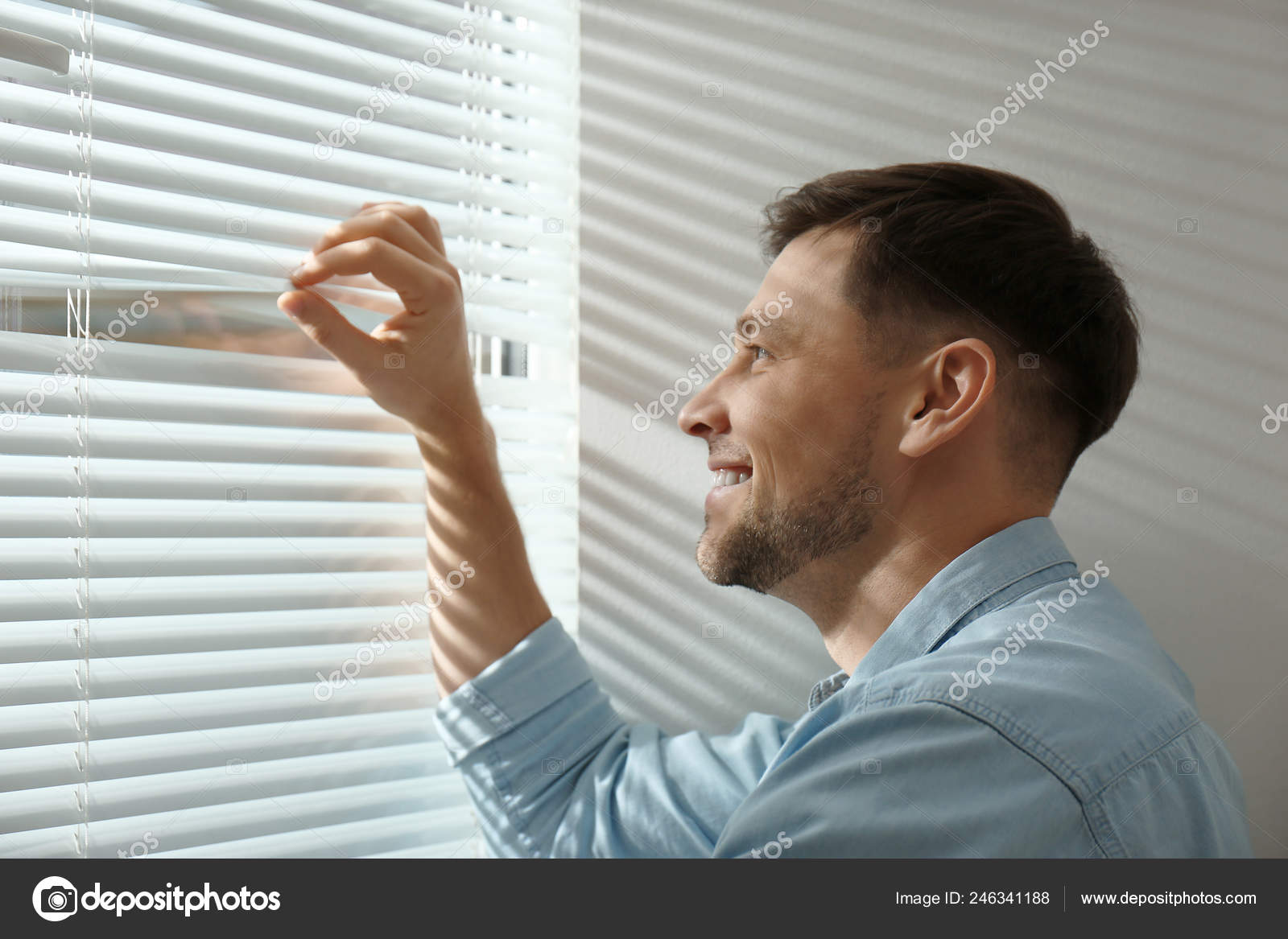 Handsome Man Opening Window Blinds Home Stock Photo by ©NewAfrica 246341188